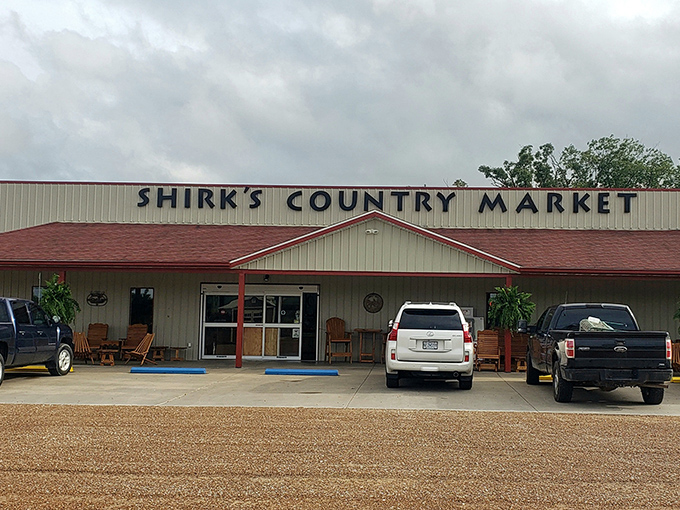 Wooden porch swings beckon hungry travelers outside Shirk's Country Market, where rural charm meets sandwich excellence in Centertown, Missouri.