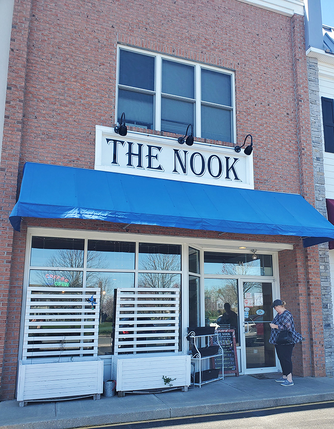 The brick façade and bright blue awning of The Nook stands as Milton's humble breakfast fortress, where culinary magic happens without fanfare or fuss.