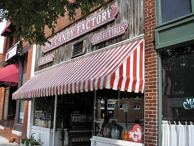 The iconic red-and-white striped awning beckons like a sugary lighthouse, guiding sweet-toothed sailors to this brick-fronted paradise in downtown Lexington.