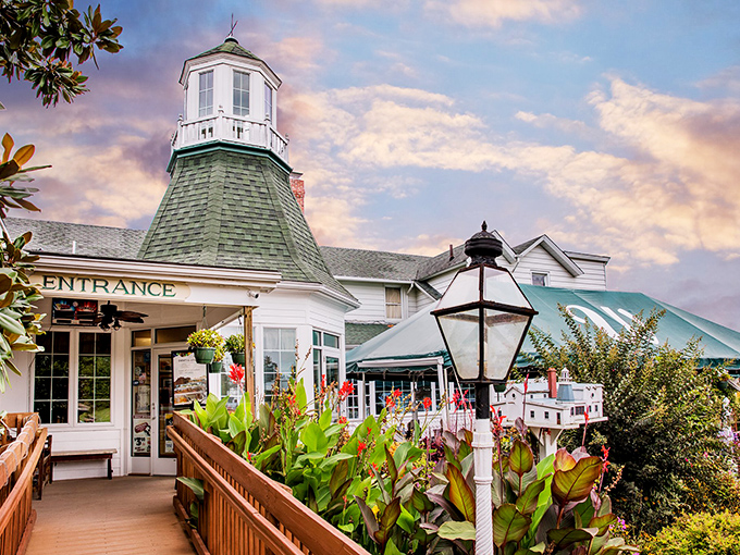 The iconic lighthouse cupola of The Wellwood isn't guiding ships—it's beckoning hungry travelers to a seafood sanctuary where history meets hospitality.
