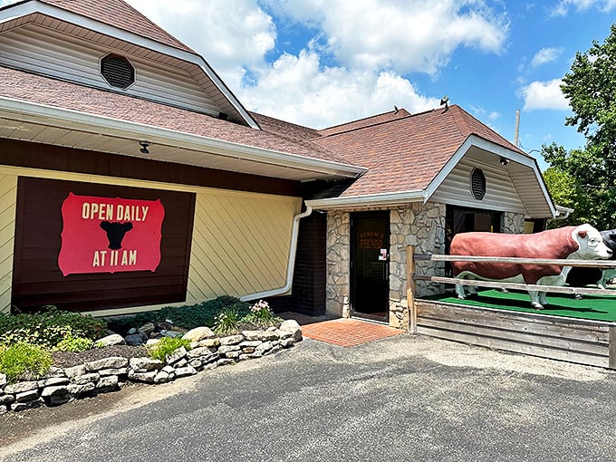 Those plastic cow sentinels aren't just for show—they're the first clue you've found a place where steak is serious business.
