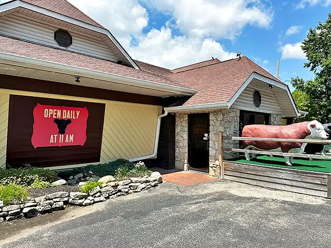 Those plastic cow sentinels aren't just for show—they're the first clue you've found a place where steak is serious business.