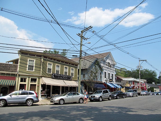 Charming cedar-shingled architecture gives Chester its storybook appeal. This cottage-style shop epitomizes New England charm with seasonal planters adding vibrant color. 