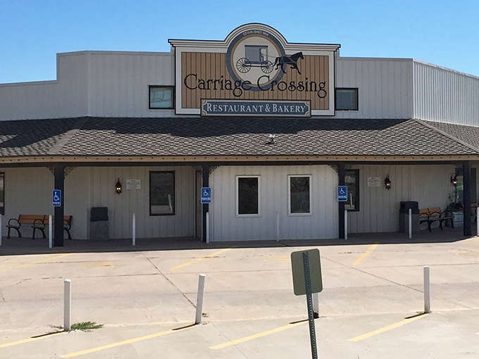 The iconic Carriage Crossing exterior stands proudly against the Kansas sky, complete with an authentic Amish buggy that isn't just for show.