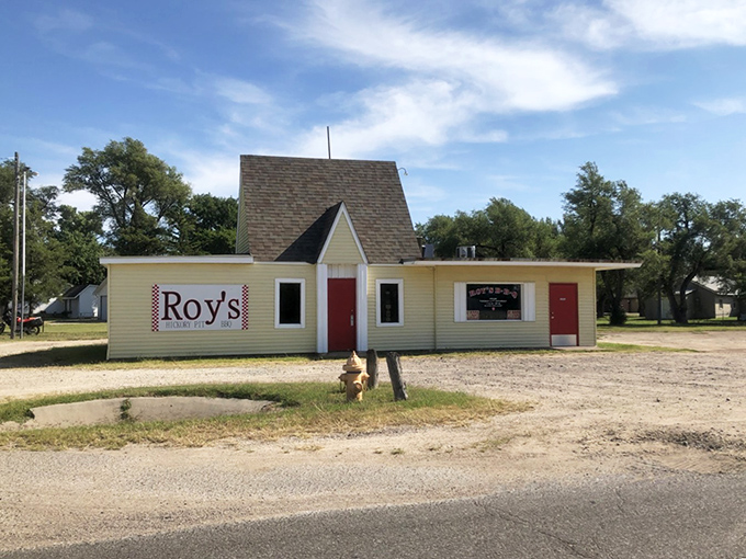 The unassuming yellow building with its bright red door stands like a beacon of barbecue hope on Hutchinson's West 4th Avenue.