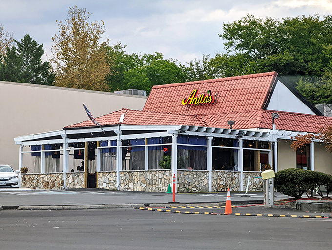 The distinctive terracotta roof and stone facade of Anita's stands like a Southwestern mirage in suburban Fairfax, beckoning hungry travelers with promises of New Mexican delights.