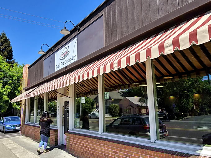 The red-and-white striped awning isn't just charming - it's nature's way of signaling "life-changing pie ahead," like a delicious warning system for your taste buds.