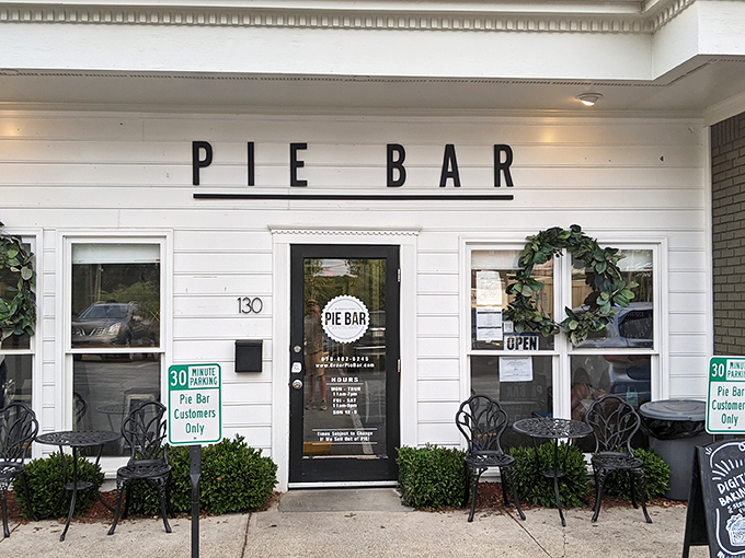 The simple white facade of Pie Bar beckons like a whisper among Woodstock's historic buildings – pie paradise awaits inside.