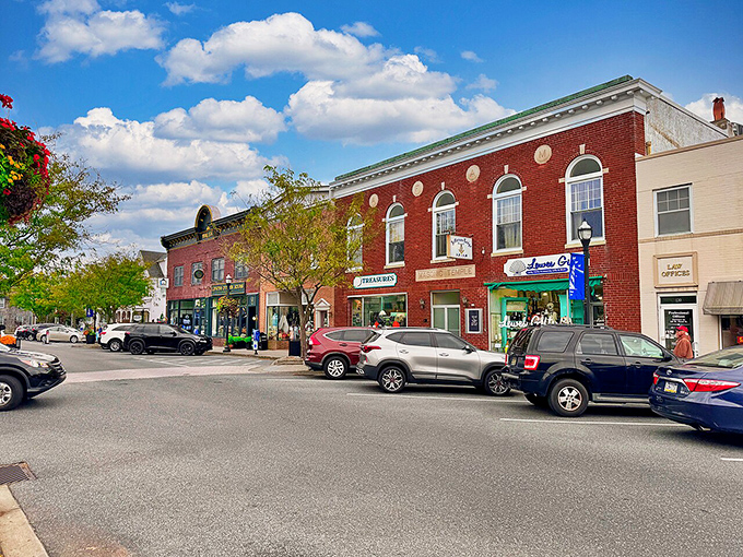 Downtown Lewes blends colonial charm with coastal flair, where shoppers stroll brick sidewalks beneath trees that have witnessed centuries of history unfold.