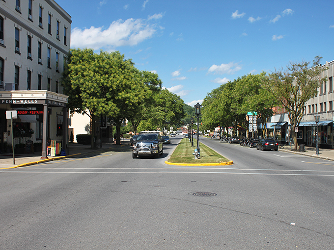 Wellsboro's iconic gas lamps line the grassy boulevard of Main Street, creating a scene straight out of a Norman Rockwell painting.