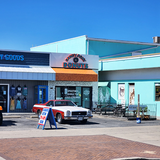 The turquoise beacon of breakfast bliss stands proudly on Bethany Beach's coastline, promising hot donuts that are worth every sandy footprint you'll track inside.