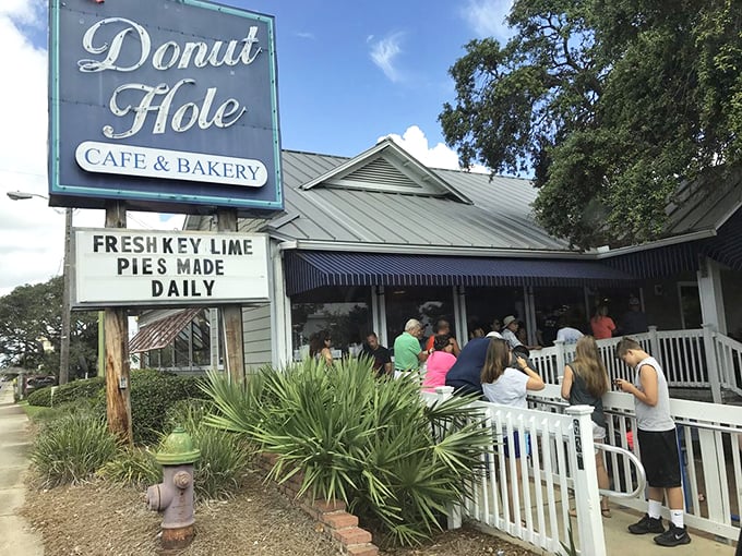 The white picket fence leading to donut paradise isn't just charming—it's a warning that your diet plans are about to be gloriously derailed.