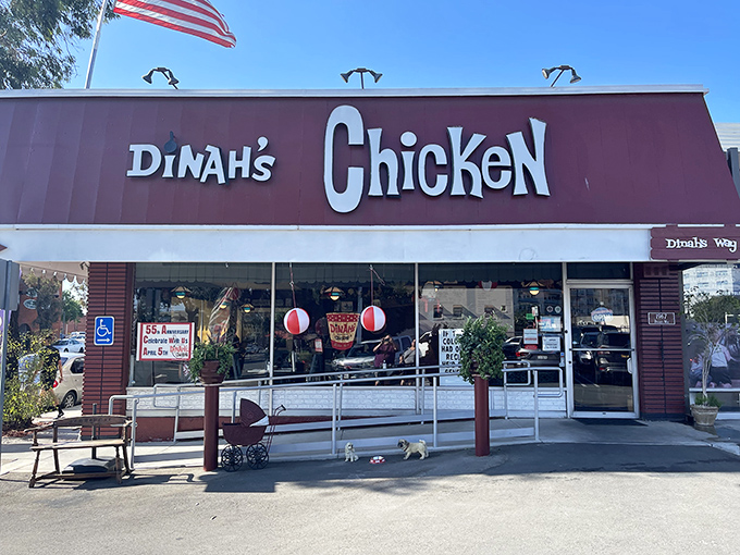 The iconic red roof of Dinah's Chicken stands like a beacon of comfort food salvation in Glendale, complete with an American flag that seems to salute your good taste.