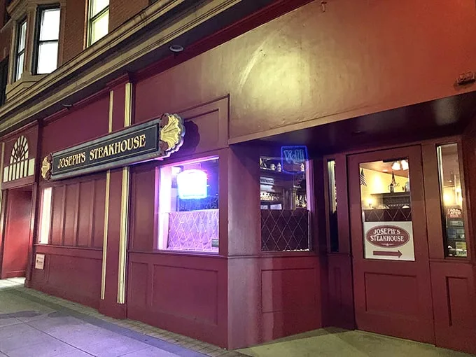 The unassuming brick façade of Joseph's Steakhouse hides culinary greatness like Clark Kent's glasses hide Superman. Classic signage promises old-school excellence.