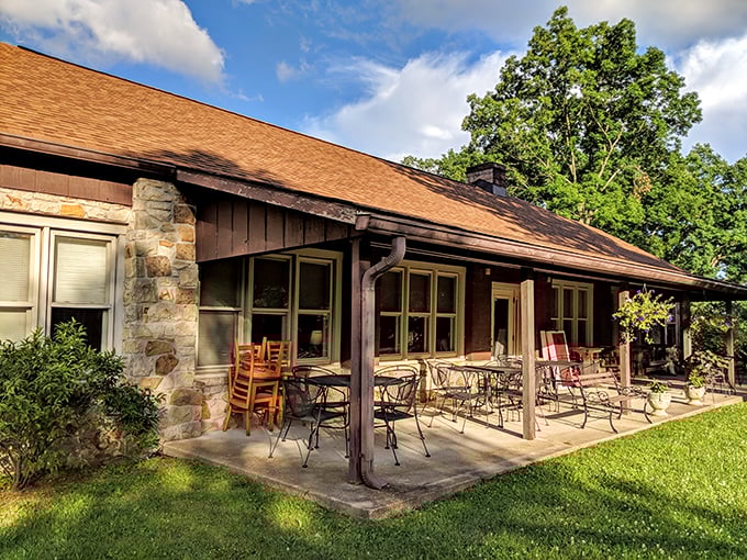 The rustic stone exterior and covered porch of Hilltop Restaurant isn't trying to impress anyone—and that's precisely why it does.