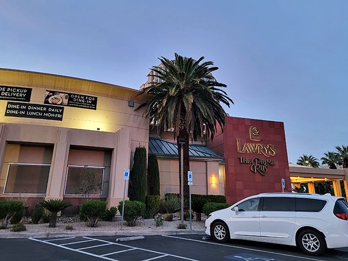 The unassuming exterior of Lawry's The Prime Rib stands like a calm oasis amid Vegas's neon storms. Palm trees welcome you to this temple of meat.