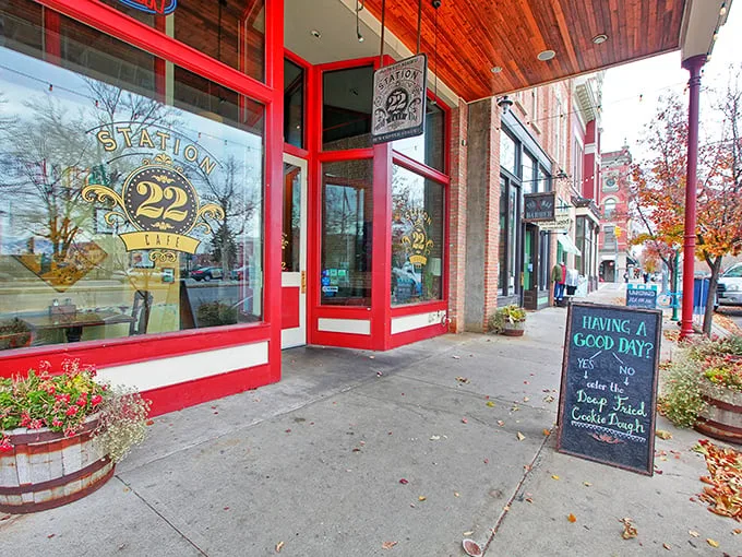 Station 22's vibrant red-trimmed exterior isn't just inviting—it's practically winking at you with that cheeky sidewalk sign promising deep-fried cookie dough salvation.