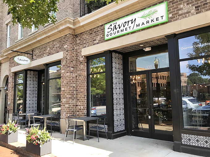 The brick façade and green accents of The Savory Gourmet Market beckon like a culinary lighthouse in Alpharetta. Simple outside, spectacular inside—just wait.
