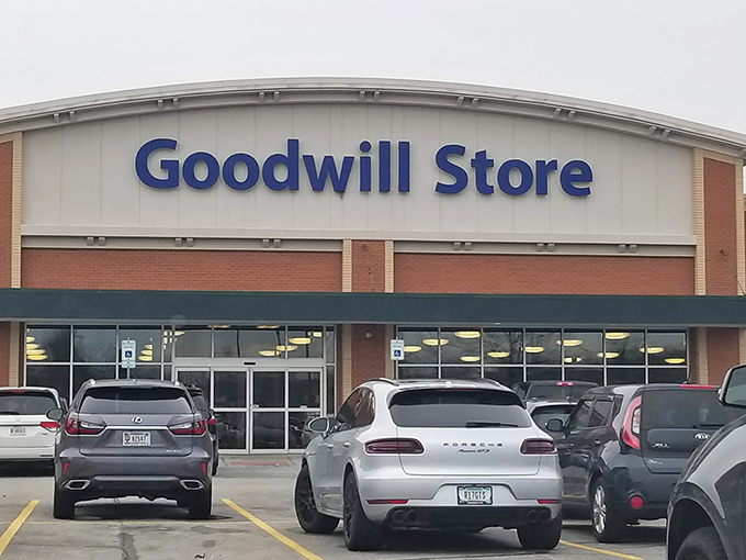 The Goodwill Store in Fishers stands like a fortress of forgotten treasures, its blue sign beckoning bargain hunters and nostalgia seekers alike.