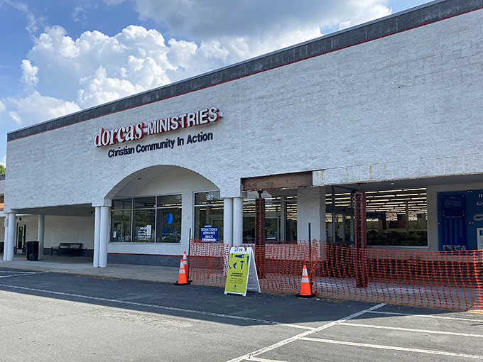 The welcoming façade of Dorcas Ministries invites treasure hunters with its clean white exterior and clear signage about donation procedures and store hours. 