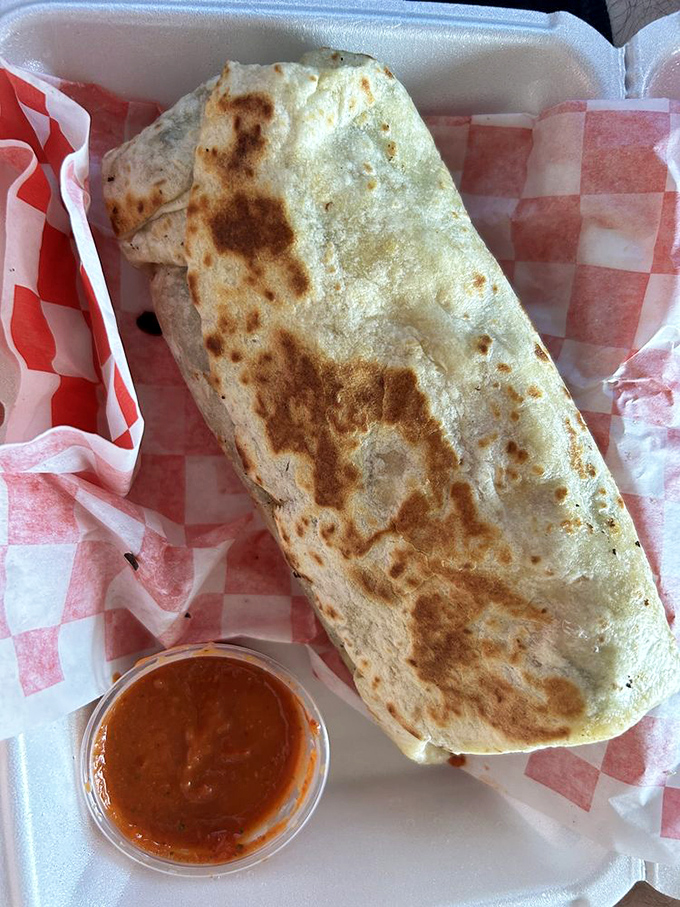 This burrito isn't just a meal, it's a commitment. The perfectly blistered tortilla is just a hint of the flavor fiesta waiting inside.