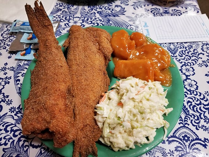 Cornmeal-crusted catfish that tastes like it jumped from the river straight into a cast iron skillet of Southern magic.