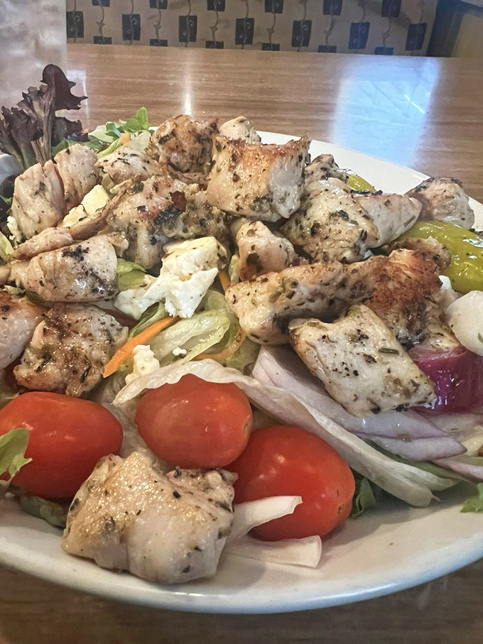 A grilled chicken salad that proves healthy eating doesn't mean punishment. Those perfectly charred chicken chunks are having a party with fresh vegetables.
