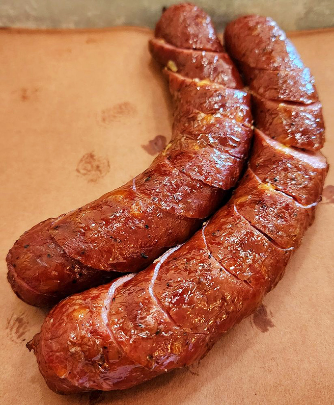 These sausages glisten with promise and possibility. The snappy casing barely contains the juicy, spicy interior—nature's perfect meat delivery system.