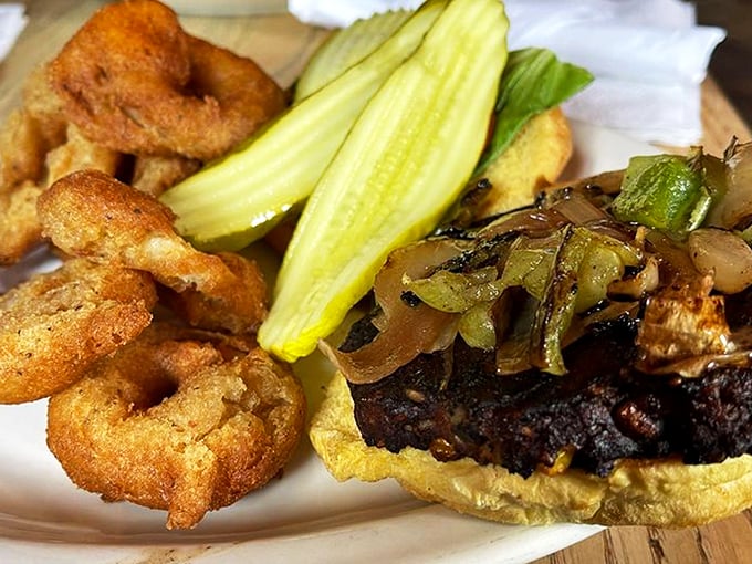 The black bean burger with grilled onions proves vegetarian options don't have to be punishment—they can be rebellion on a bun.