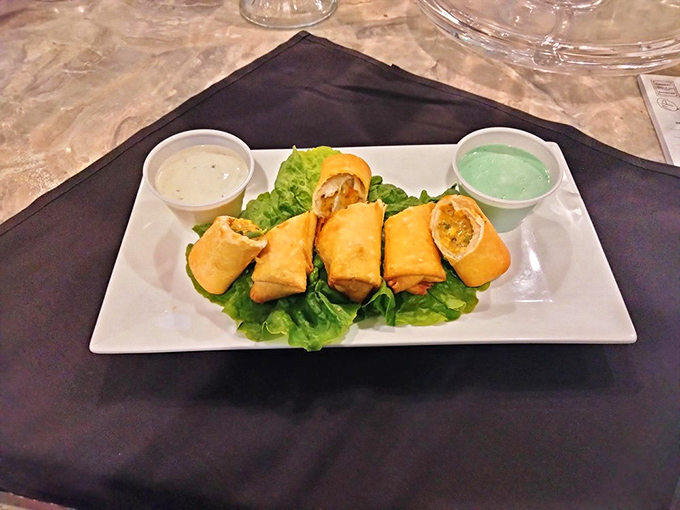 These golden egg rolls aren't just appetizers—they're edible treasure chests. Two dipping sauces means double the flavor adventure.