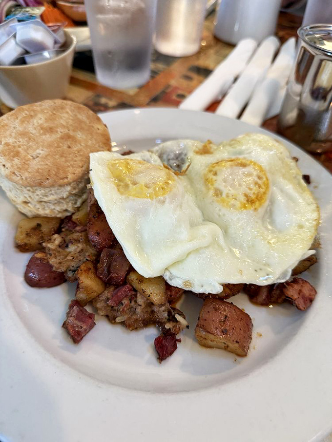 Rustic corned beef hash topped with sunny-side-up eggs – the kind of breakfast that makes you want to high-five the chef.