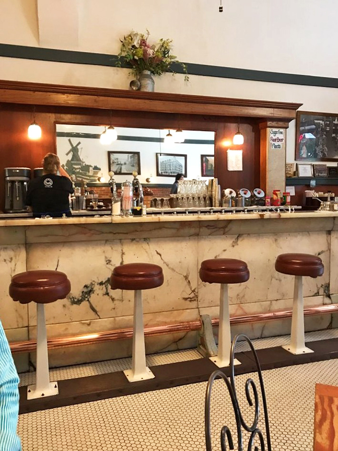 The counter seats—those coveted front-row tickets to culinary theater where you can watch soda jerks work their magic with the choreography of seasoned dancers.