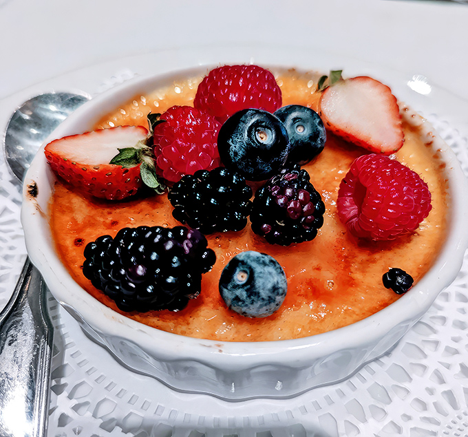 This crème brûlée with fresh berries doesn't just end your meal—it provides closure. The perfect sweet finale to a symphony of savory notes.