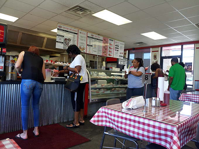 The ordering counter is where dreams begin—customers patiently waiting their turn for a taste of hand-held heaven.