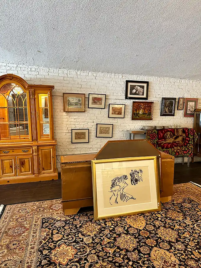 A gallery wall emerges organically among the furniture, proving good taste doesn't require a designer's budget—just a good eye.