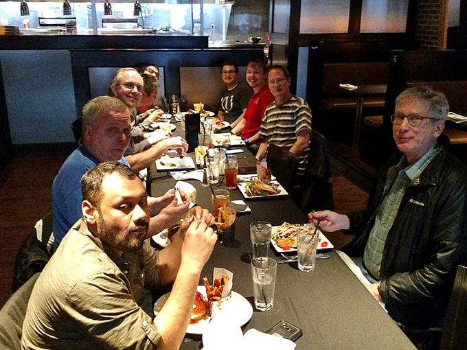 Great food brings people together. These diners aren't just eating—they're creating memories that will outlast the meal itself.