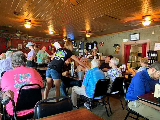 The servers here don't just bring food—they create community. That "Camp Without Pain" shirt says everything about the local philosophy.