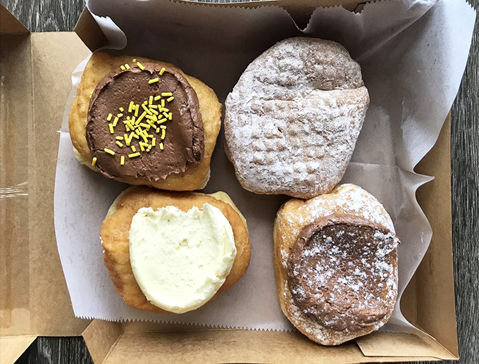 The storefront that launched a thousand cravings. That "OPEN" sign is the most beautiful word in the English language when donuts are involved. 