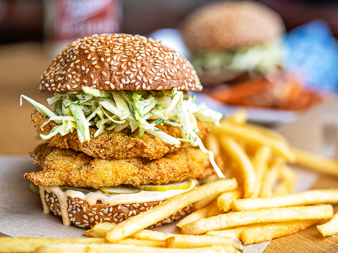 A sandwich that requires both hands and your full attention—crispy catfish and crunchy slaw creating the perfect textural tango.