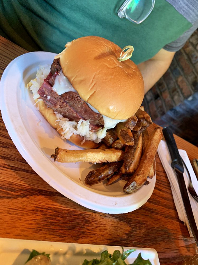 This sandwich has layers like a good novel—corned beef with melty cheese creating a story your taste buds won't forget.