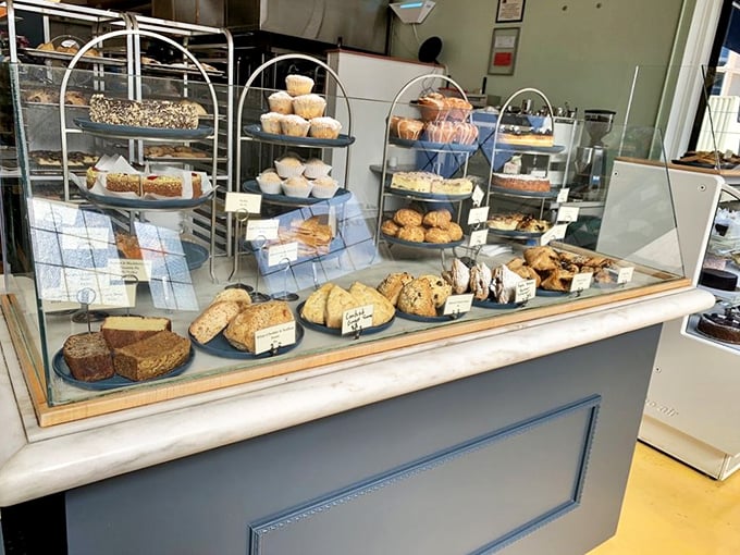This isn't just a bakery display—it's carbohydrate heaven. Breads and pastries arranged with the care of a curator organizing a delicious exhibition.