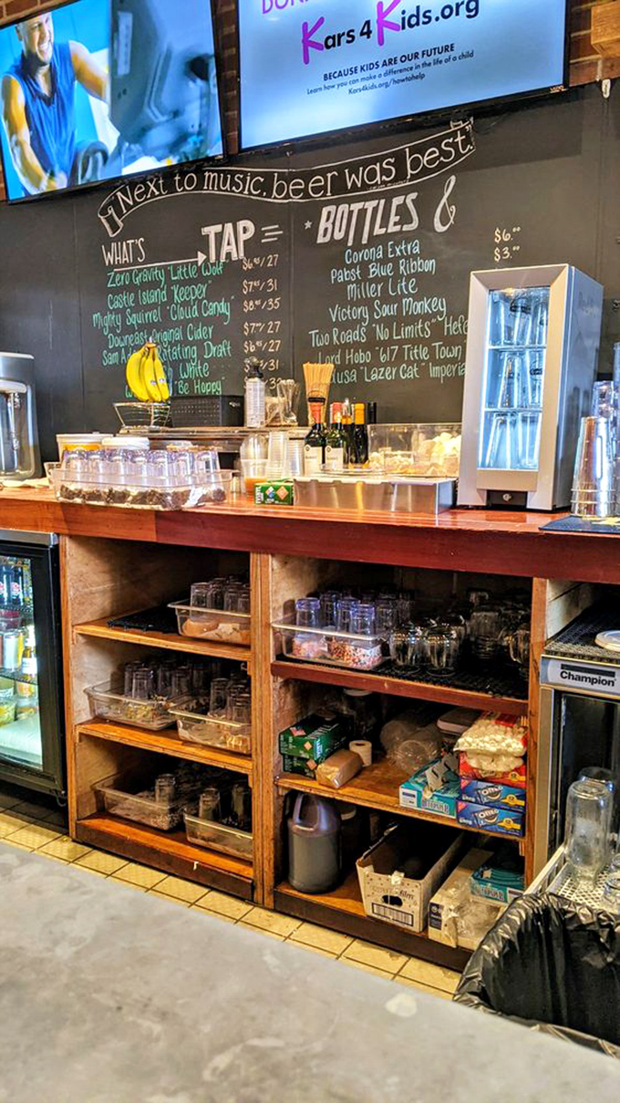 The beer board tempts with local brews, while the organized chaos below reveals the foundation of any great burger joint.