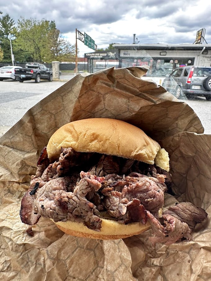 The sandwich in its natural habitat—your car. Some pleasures can't wait for a proper table setting.