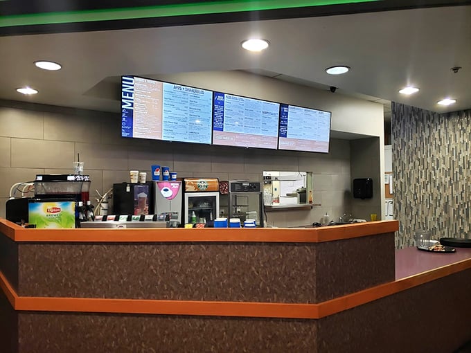 The snack counter—where bowling legends fuel up on nachos and liquid courage before attempting that impossible 7-10 split.