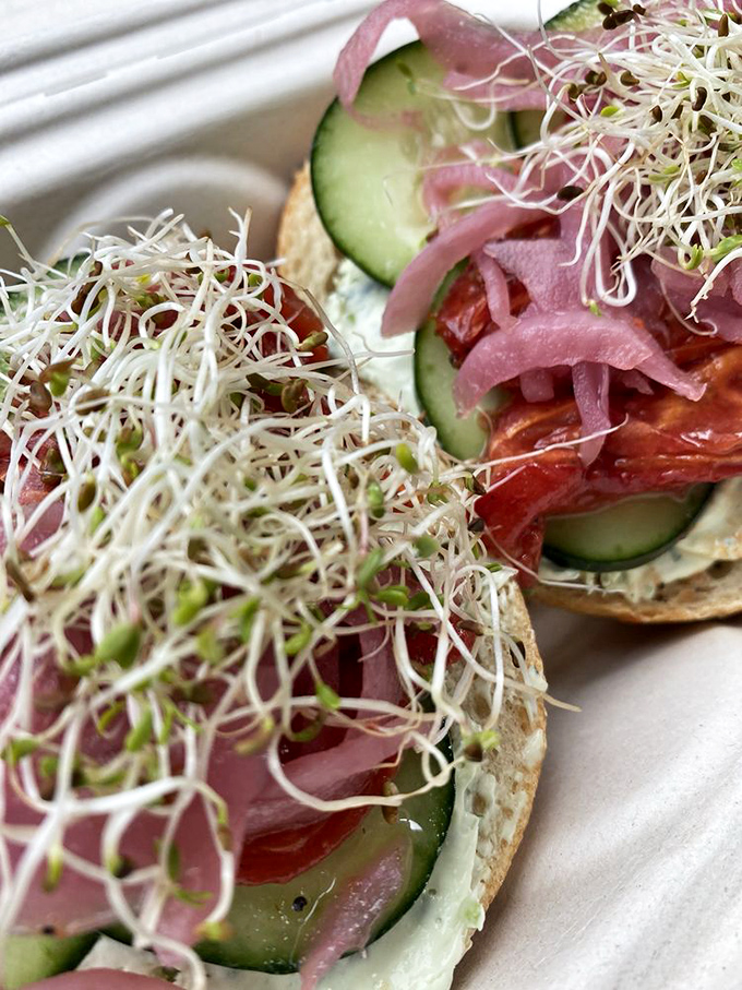 A garden party on a bagel. Those sprouts aren't just garnish—they're participating fully in this flavor conversation.