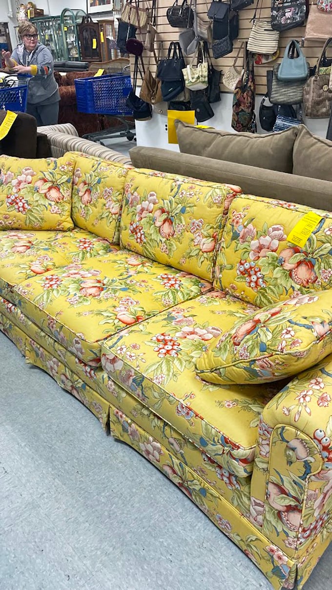 A sunshine-yellow floral sofa that screams "1980s sunroom"—so boldly vintage it's circled back to being the statement piece your living room secretly craves. 