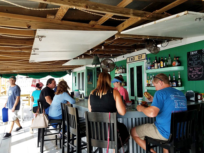 Where "END OF" sign should really finish with "your search for authentic seafood" – no pretension, just perfect libations.