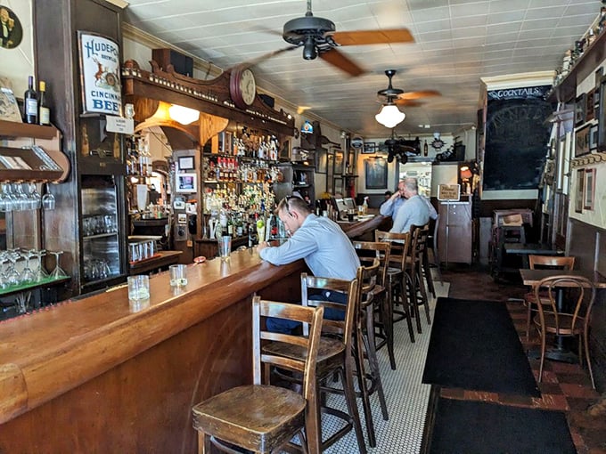 The bar at Arnold's isn't where you go to be seen—it's where you go to feel seen, with bartenders who remember your name and pour with purpose.