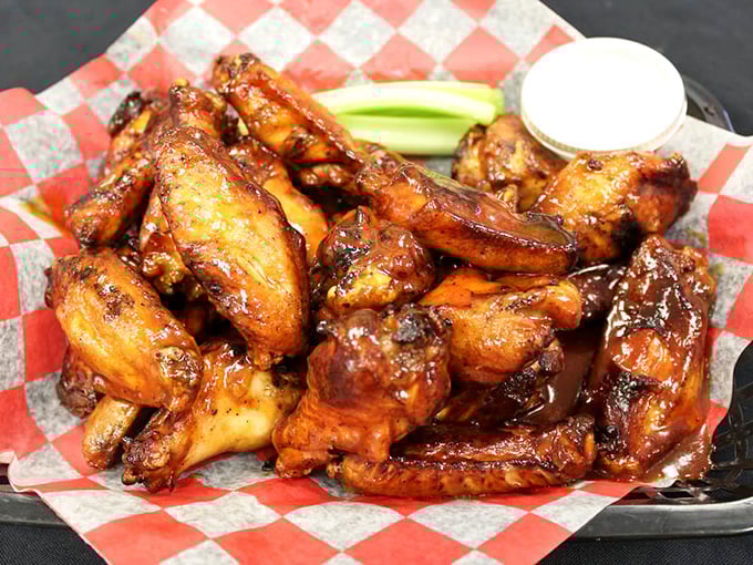 These wings aren't just cooked—they're transformed into glistening, sauce-lacquered flavor bombs that make you wonder why we ever bothered with buffalo.