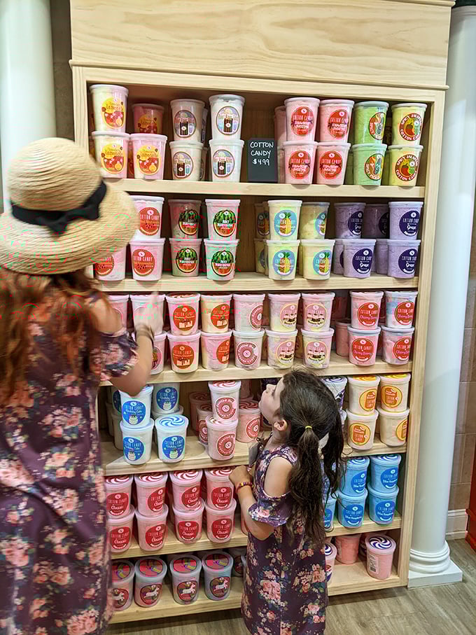 Cotton candy in cups: proof that someone finally solved the age-old problem of sticky fingers and wind-destroyed sugar clouds.